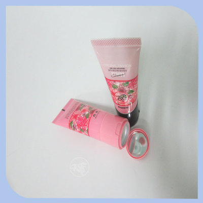 plastic cosmetic tube with mirror flip top cap
