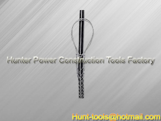 Hanger grip for electrical cable as it hangs in vertical, sloping