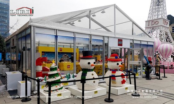 Transparent clear span event tent with glass walls and glass doors