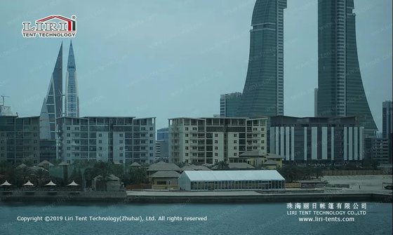 alluminum frame clear span tent with glass sidewalls and sandwich panel